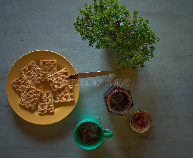 Overhead Top View of Crackers on a Plate on the Table with a Cup of Tea ...