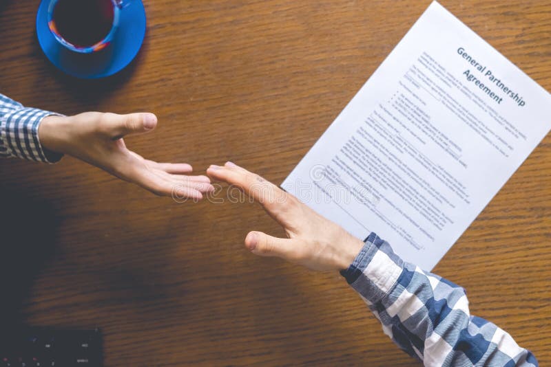 Overhead Top View of Two Workers in Casual in the Office Signing the ...