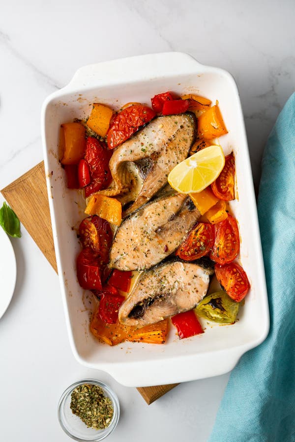 Overhead View of Baking Fish with Tomatoes in Dish Stock Image - Image ...