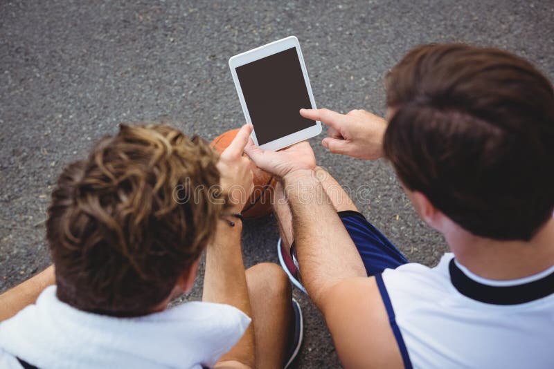 Overhead View of Basketball Players Using Digital Tablet Stock Image ...