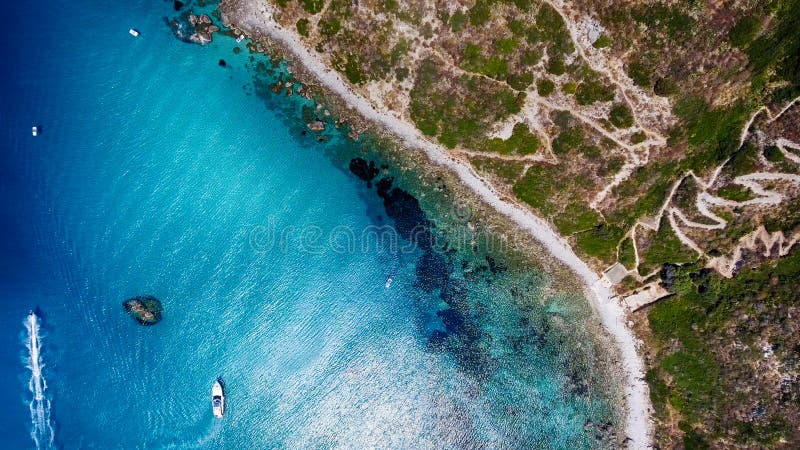 Overhead View of Beautiful Rocks Over Crystal Clear Ocean Stock Photo ...
