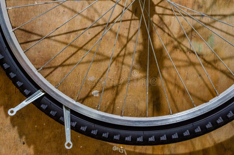 Overhead View of a Bicycle Wheel and Tire with Two Tire Removal Tools ...