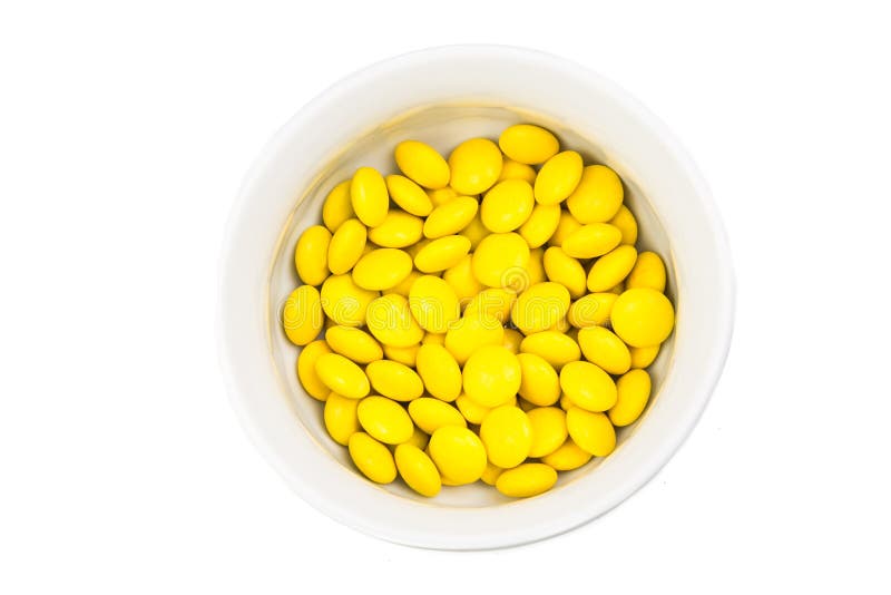 Overhead View Bowl of Yellow Chocolate Candy in White Background Stock ...
