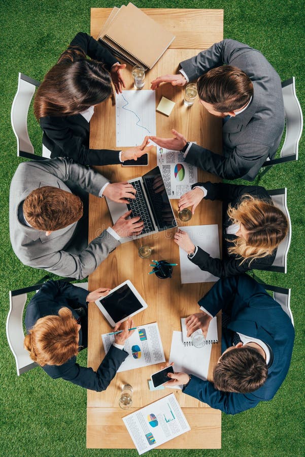 Overhead View of Business Colleagues Working at Table Stock Photo ...