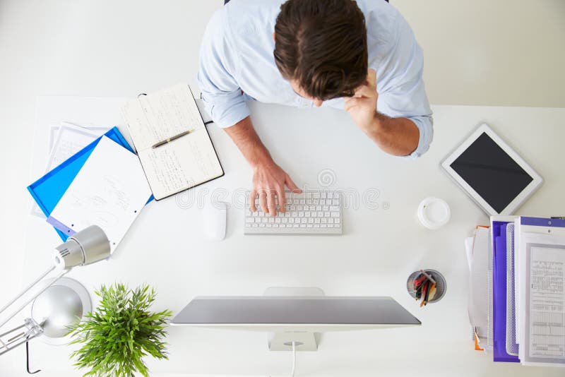 Overhead View of Businessman Working at Computer in Office Stock Image ...