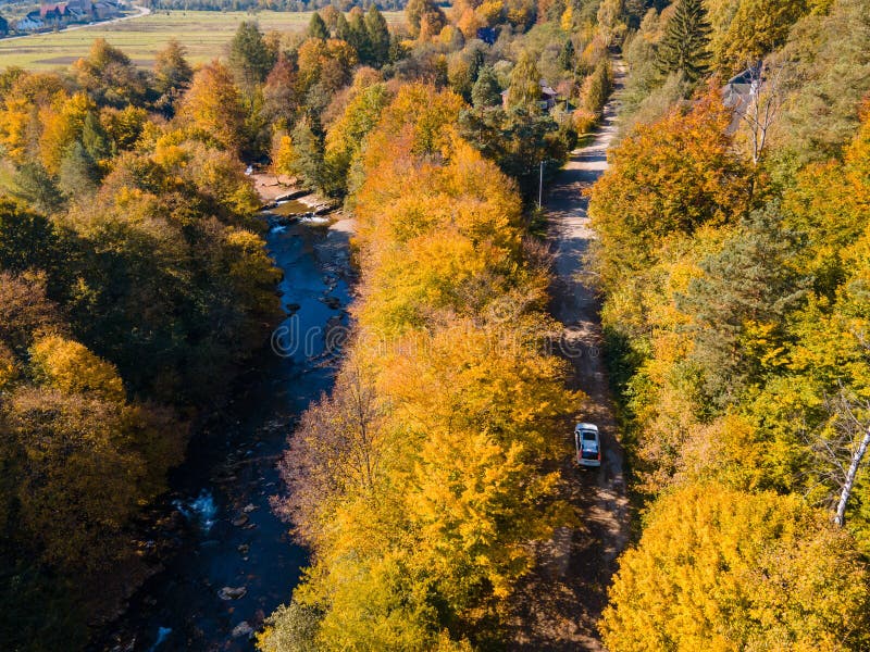 Overhead View of the Car Moving by Road in Autumn Forest Stock Image ...
