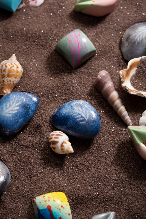 Overhead View of Chocolate Candies on Brown Sand Stock Image - Image of ...