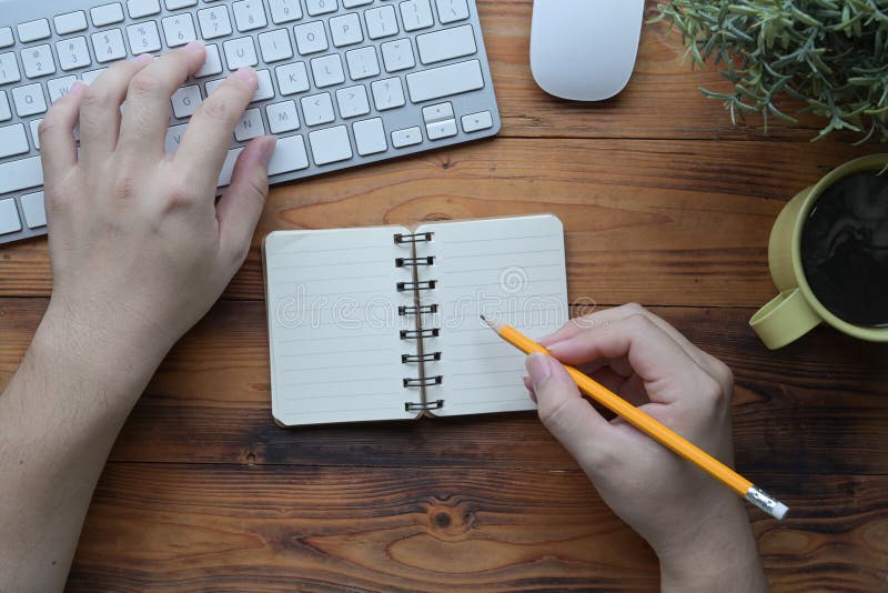 Creative Man Holding Pencil Making Note on Notebook. Stock Image ...