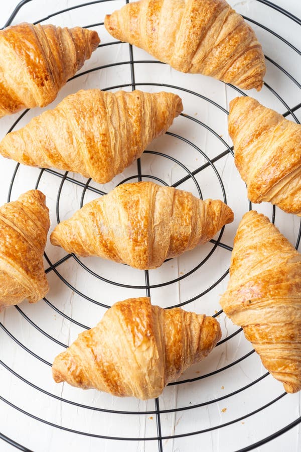 Overhead View of Croissants on Rack on White Table Stock Image - Image ...