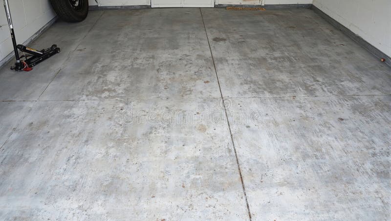 Overhead View of Garage Floor with Car Jack and Spare Tire Ideal for ...