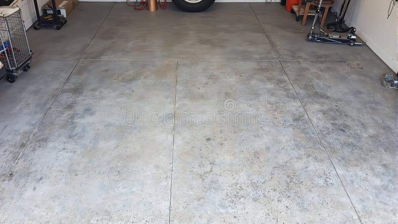 Overhead View of Garage Floor with Car Jack and Spare Tire Ideal for ...
