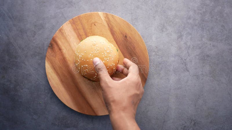 Overhead View of Hand Pick a Burger from Table Stock Footage - Video of ...
