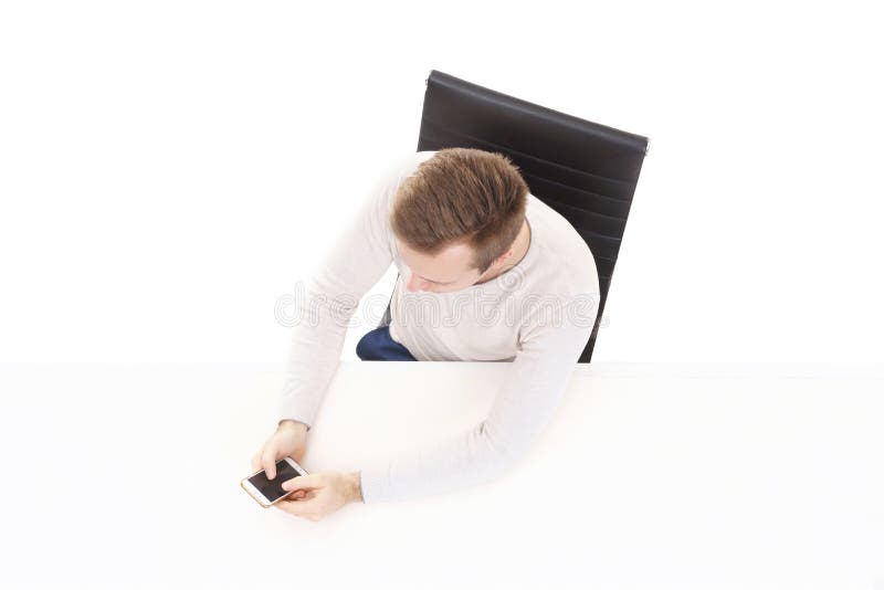 Overhead View of a Handsome Guy with Smartphone in Office. Business and ...