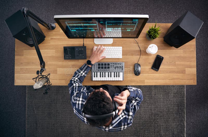 Overhead View of Male Musician at Workstation with Keyboard and ...