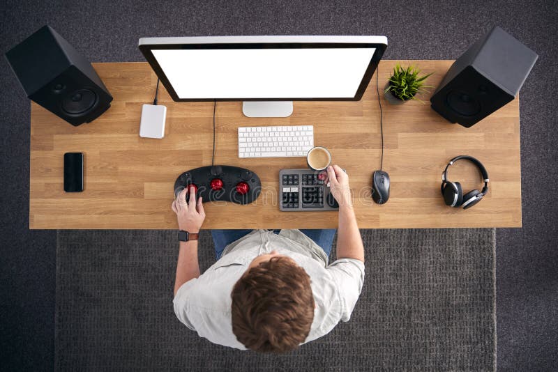 Overhead View of Male Video Editor Working at Computer in Creative ...
