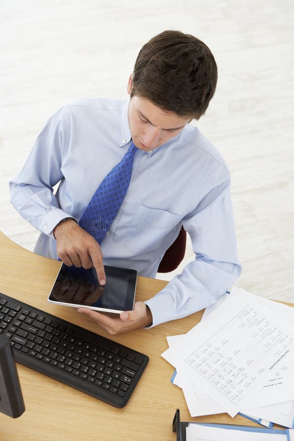 Businessman Working at Desk in Busy Office Stock Image - Image of ...
