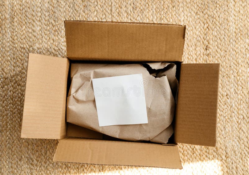 Overhead View of New Parcel Delivery Unboxing on Floor with White Paper ...