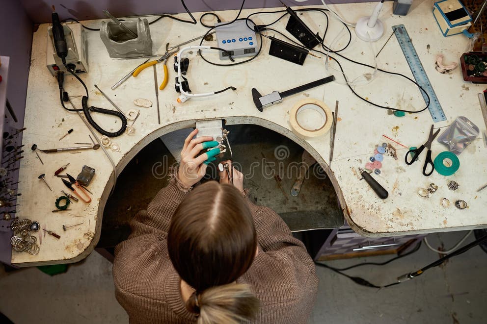 Overhead View of Person Working at Cluttered Workbench Stock Image ...