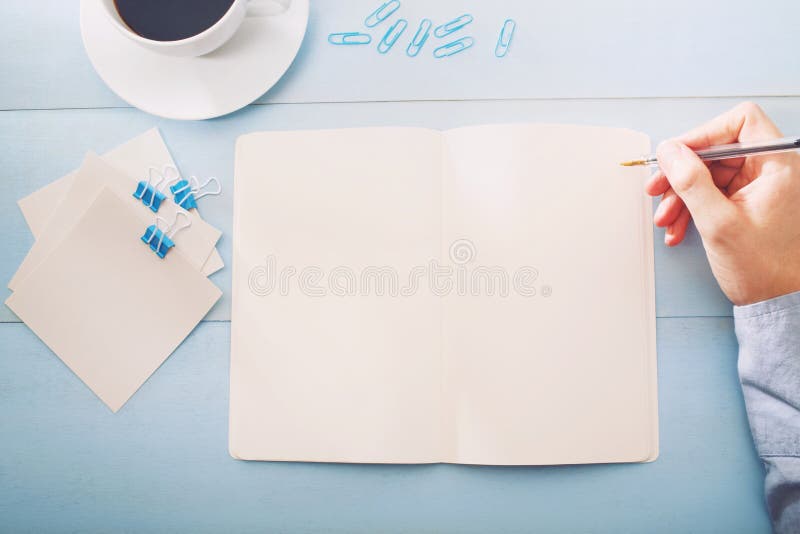 Overhead View of a Person Writing in an Open Notebook Stock Image ...