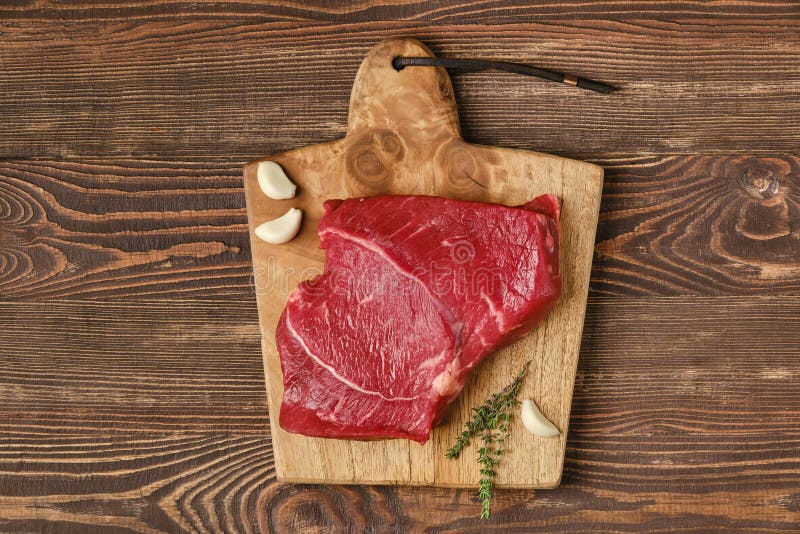 Overhead View of Raw Top Side Beef Steak on Wooden Tabletop Stock Photo ...