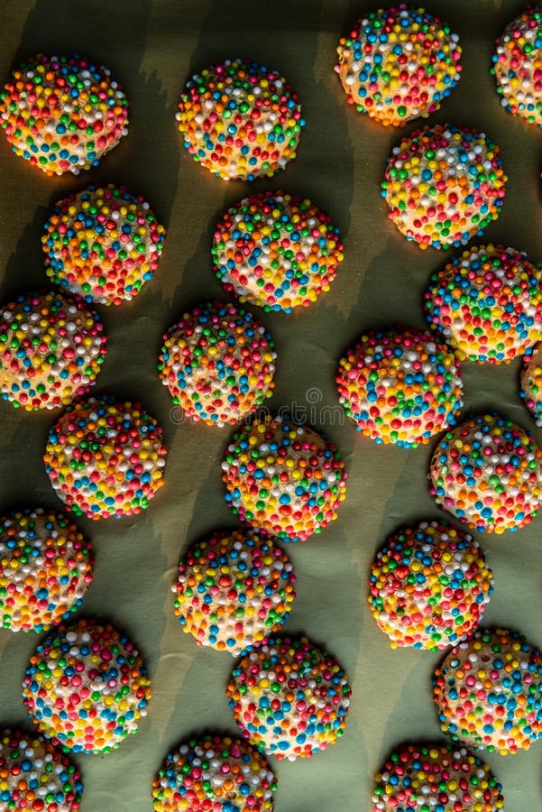 Overhead View of Rows of Small Round Cookies Covered with Colorful ...