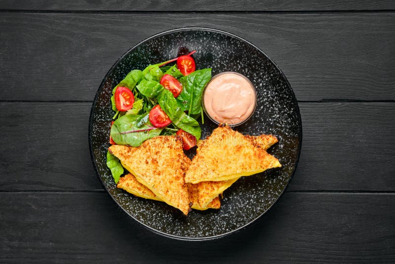 Overhead View of Sandwich with Cheddar and Salad on a Plate Stock Photo ...