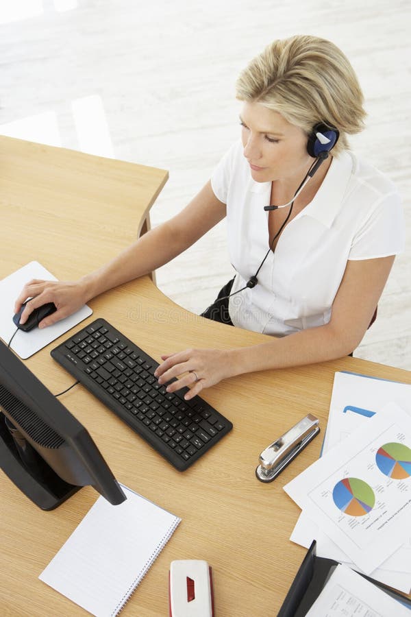 Service Agent Talking To Customer in Call Centre Stock Photo - Image of ...