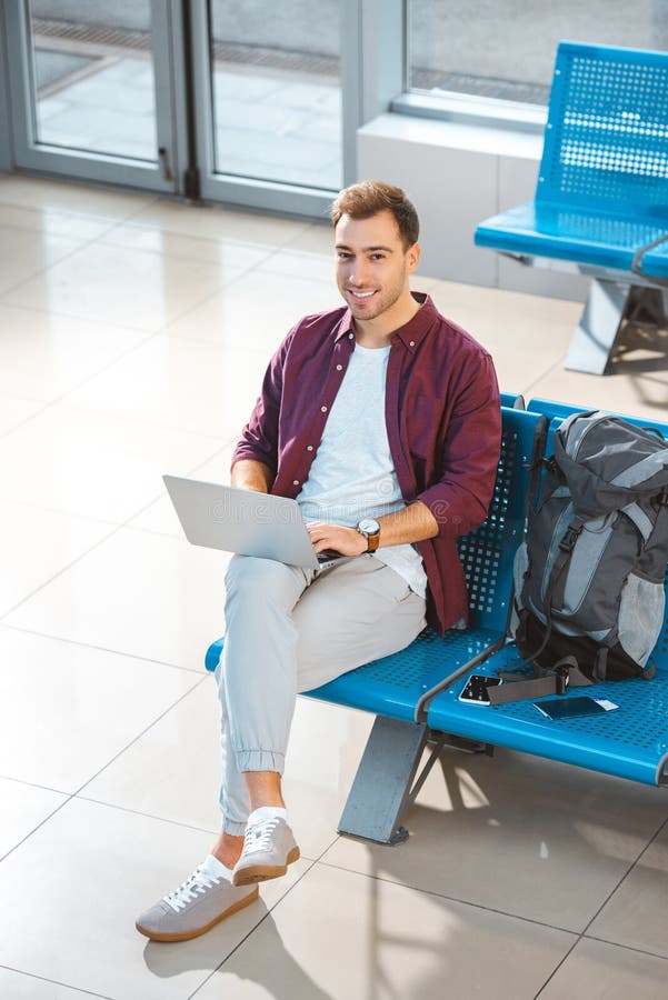 Overhead View of Smiling Man Using Laptop while Waiting Stock Image ...