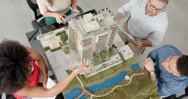 Overhead View of Team of Diverse Architects Discussing Over a 3d ...