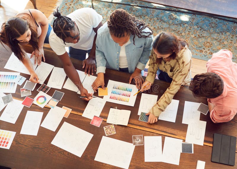 Overhead View of Team Having Creative Design Meeting Around Wooden ...