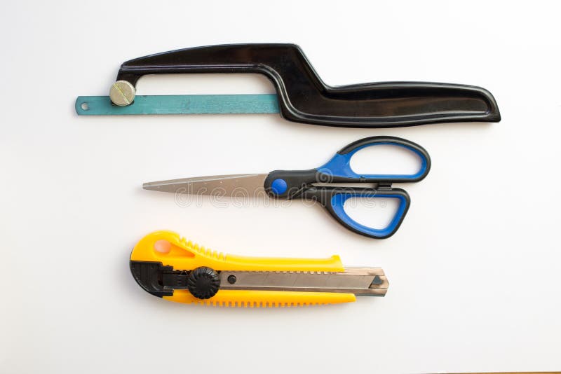 Overhead View of Three Cutting Tools - Scissors, Saws, Knife Isolated ...