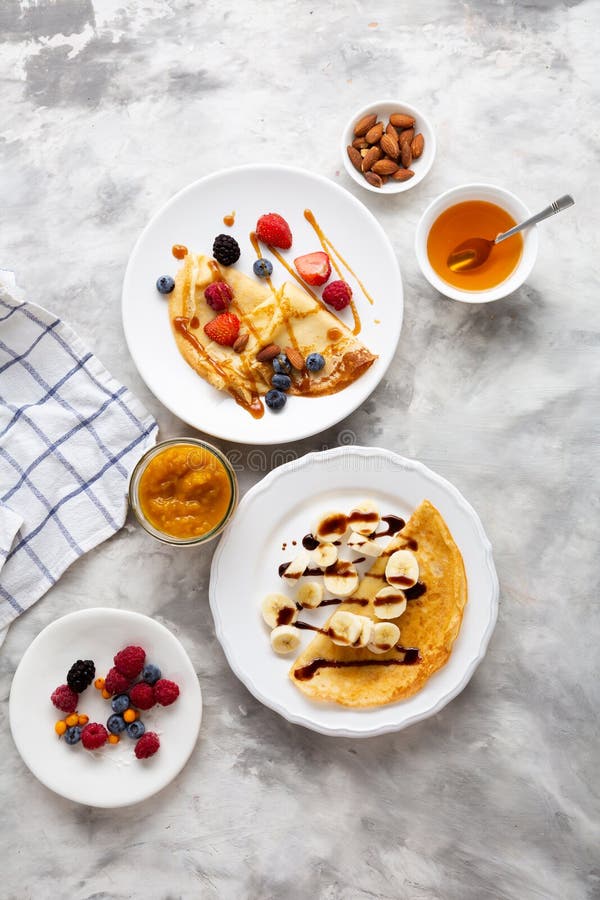 Overhead View of Two Plates with Breakfast Crepes, Blini Stock Image ...