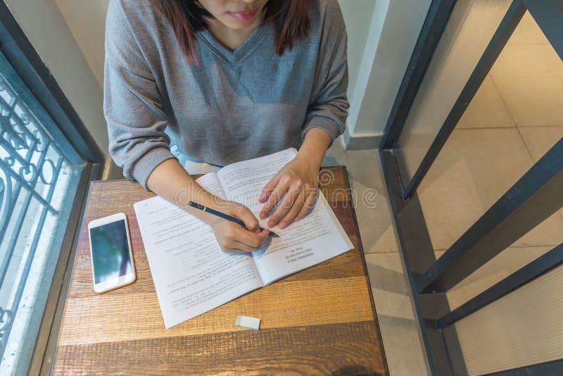 Overhead View of Young Woman Writing Note, Doing Homework Stock Photo ...