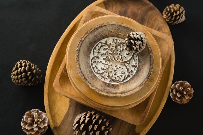 Wooden Plates Set on a Black Themed Table Stock Image - Image of ...