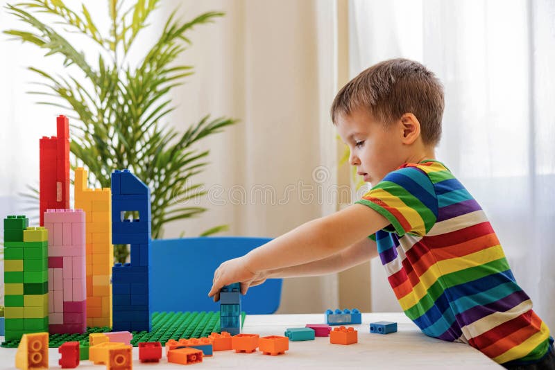 Overjoyed Baby Boy Successful Assembling Multicolored Plastic Blocks ...