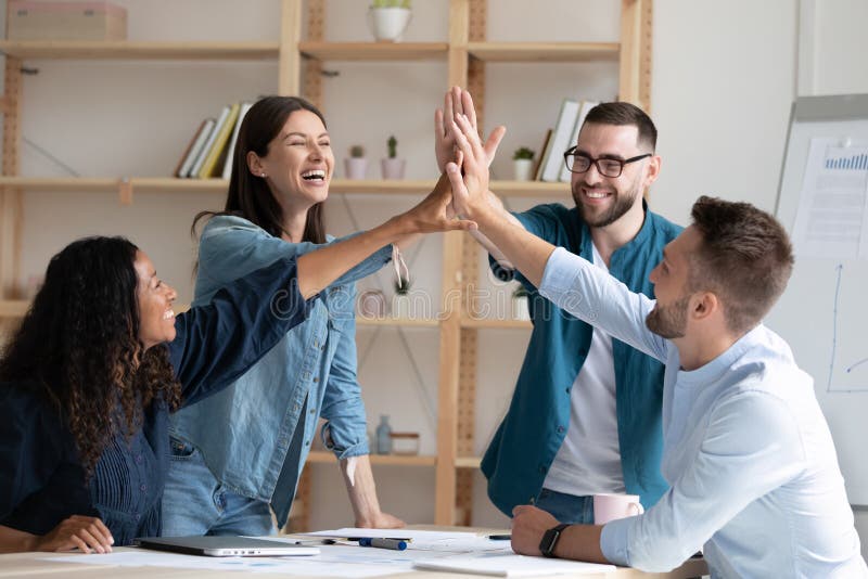 Overjoyed Diverse Employees Giving High Five at Corporate Meeting Stock ... Overjoyed Diverse Employees Giving High Five at Corporate Meeting Stock ...