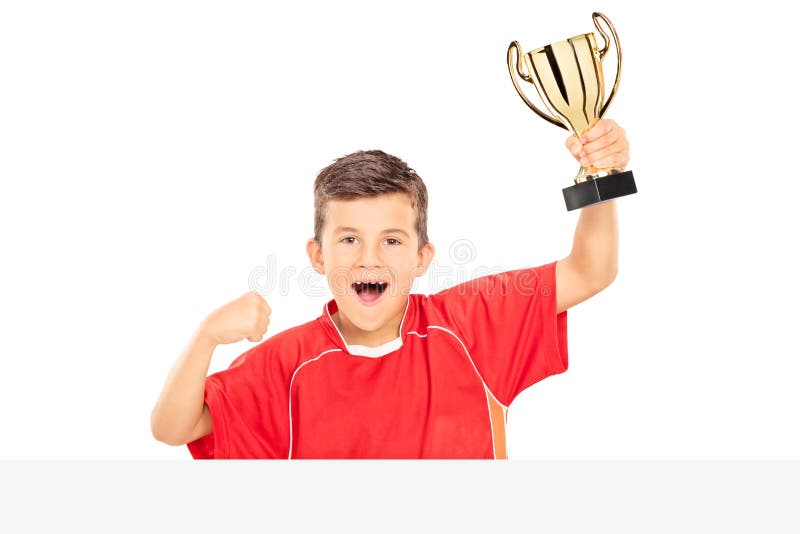 Overjoyed Kid Holding a Trophy Behind a Panel Stock Image - Image of ...