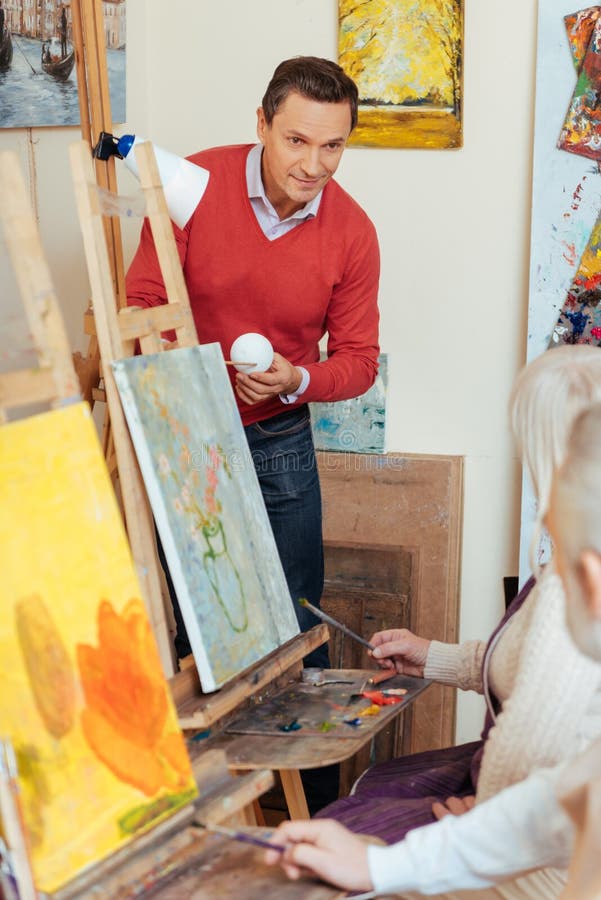 Overjoyed Man Teaching People in Painting Studio. Stock Photo - Image ...