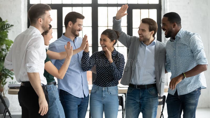 Happy Multiracial Colleagues Engaged in Teambuilding Activity at ... Happy Multiracial Colleagues Engaged in Teambuilding Activity at ...