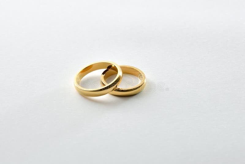 Overlapping Gold Engagement Rings Isolated on White Textured Base Stock ...