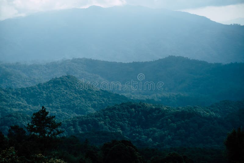 Overlapping mountains stock image. Image of overlapping - 130386025