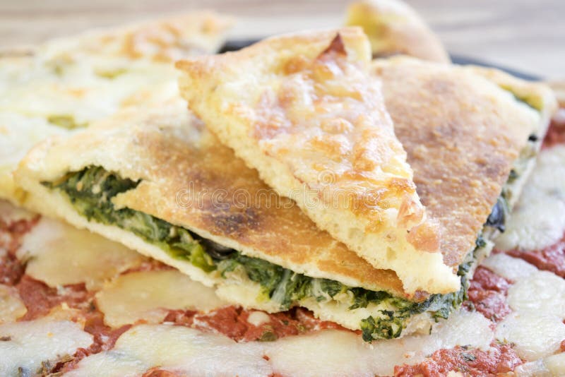 Overlapping Wedges of Home-made Pizza Stock Photo - Image of hand ...