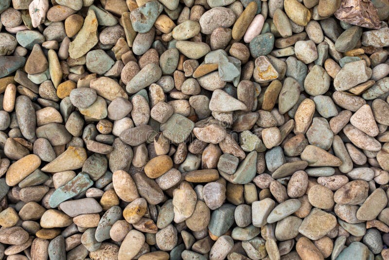 An Overlay of Various Pastel-colored and Multi-shaped Small Pebbles ...