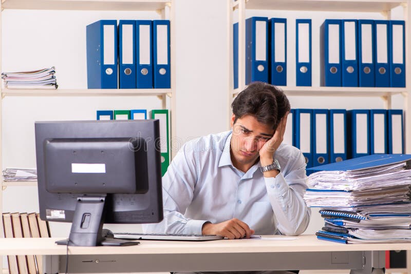 The Overloaded Busy Employee with Too Much Work and Paperwork Stock ...