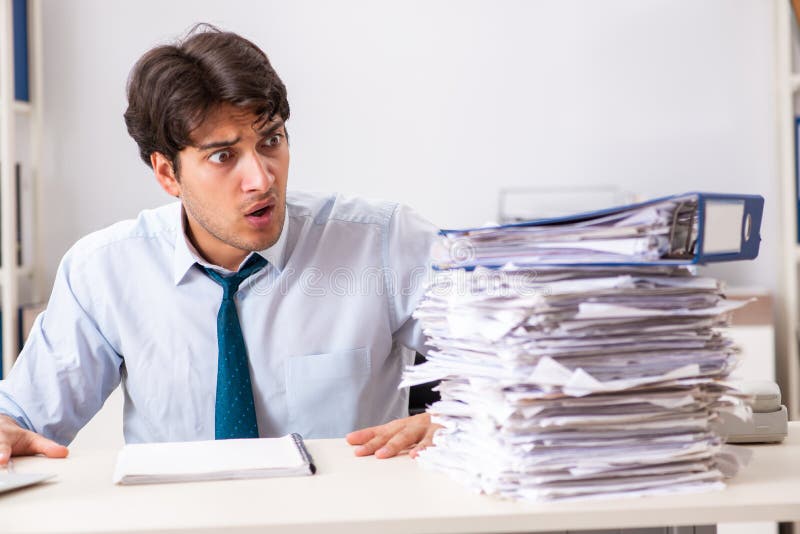 The Overloaded Busy Employee with Too Much Work and Paperwork Stock ...