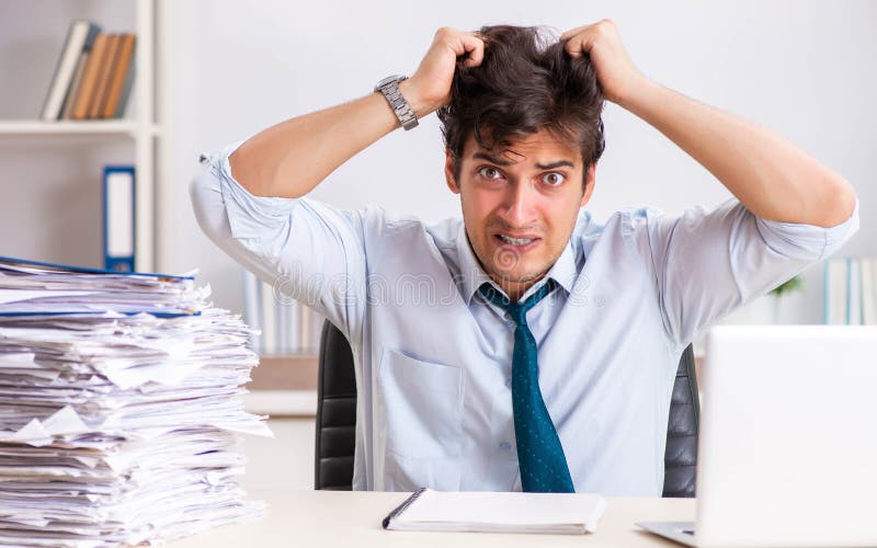 Overloaded Busy Employee with Too Much Work and Paperwork Stock Photo ...