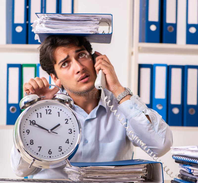 Overloaded Busy Employee with Too Much Work and Paperwork Stock Photo ...