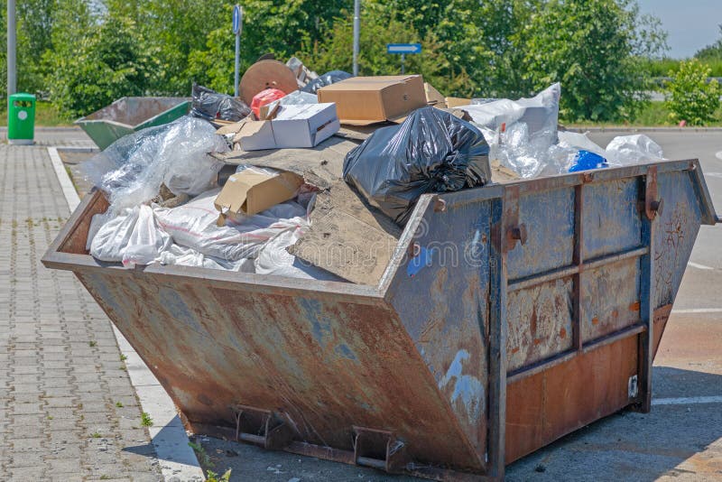 A Large Skip Container Filled To the Top with Household Waste Stock ...