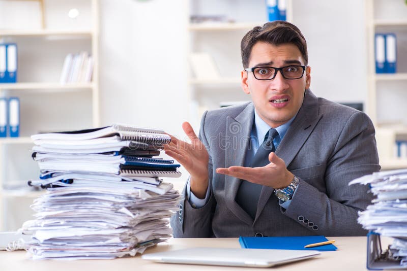 The Overloaded with Work Employee Under Paperwork Burden Stock Photo ...