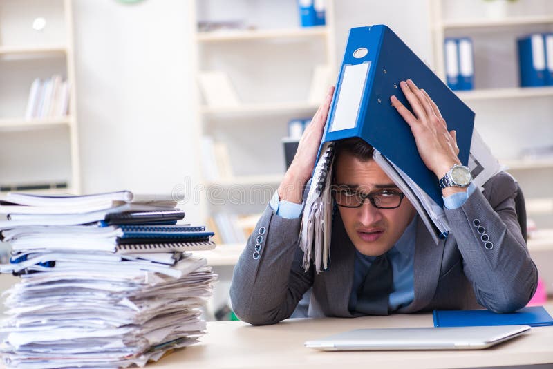 The Overloaded with Work Employee Under Paperwork Burden Stock Photo ...